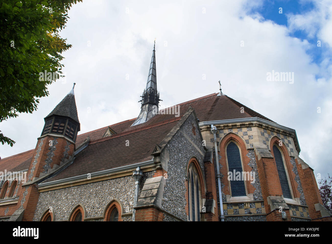 The top of a redesigned church in a suburban tudor village. Modern ...