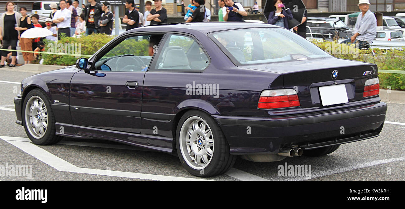 The image shows a rear view of the BMW M3 Coupe E36, highlighting the ...