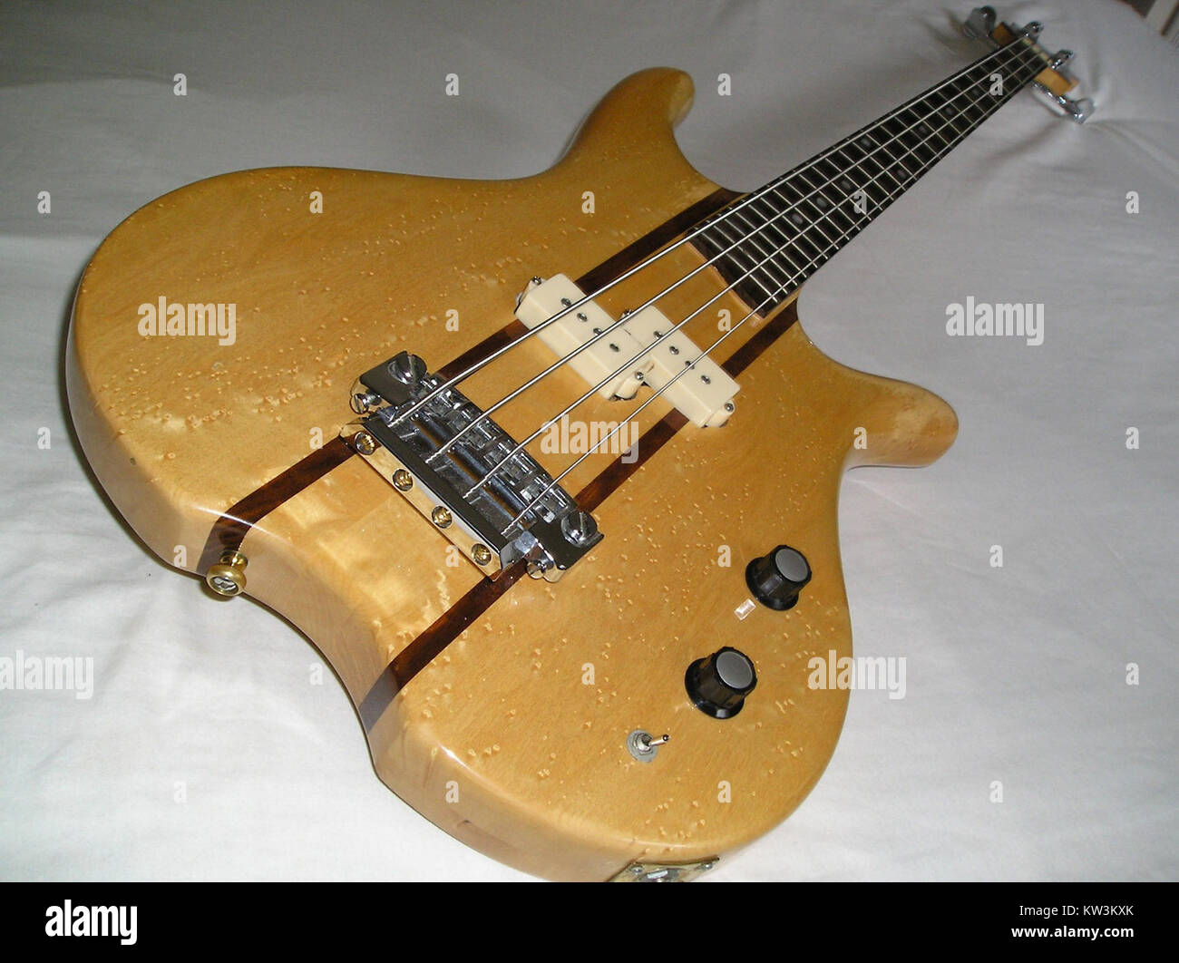 An image of a birdâ€™s eye maple body electric bass guitar, showcasing ...