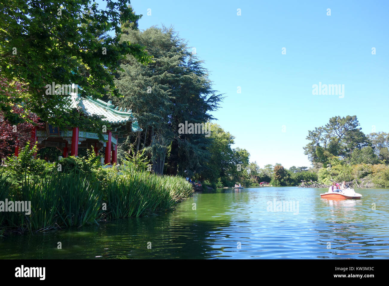 This image captures a serene moment of boating on Stow Lake in Golden ...