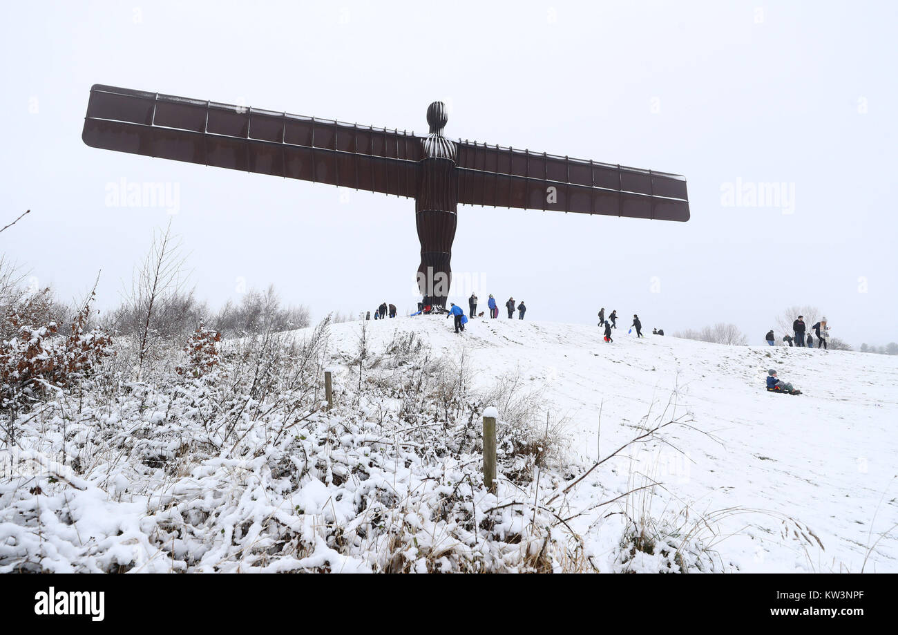 People sledging under the Angel of the North in Gateshead, after heavy ...