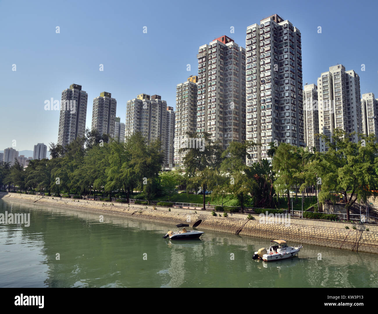 Residential blocks alongside the river bank, Tai Po, Hong Kong Stock ...
