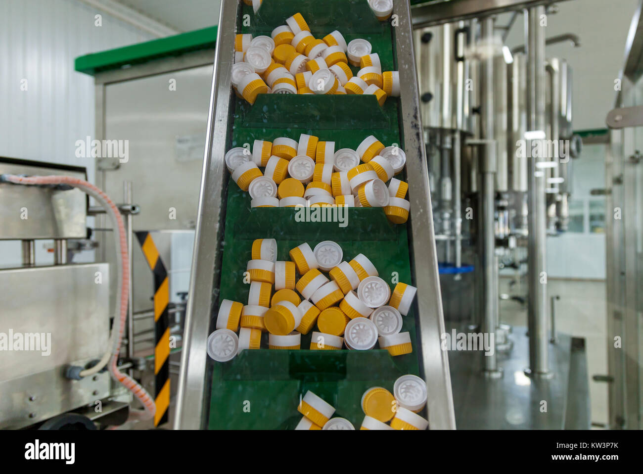 background of plastic bottle caps. plastic caps for bottles of yellow ...