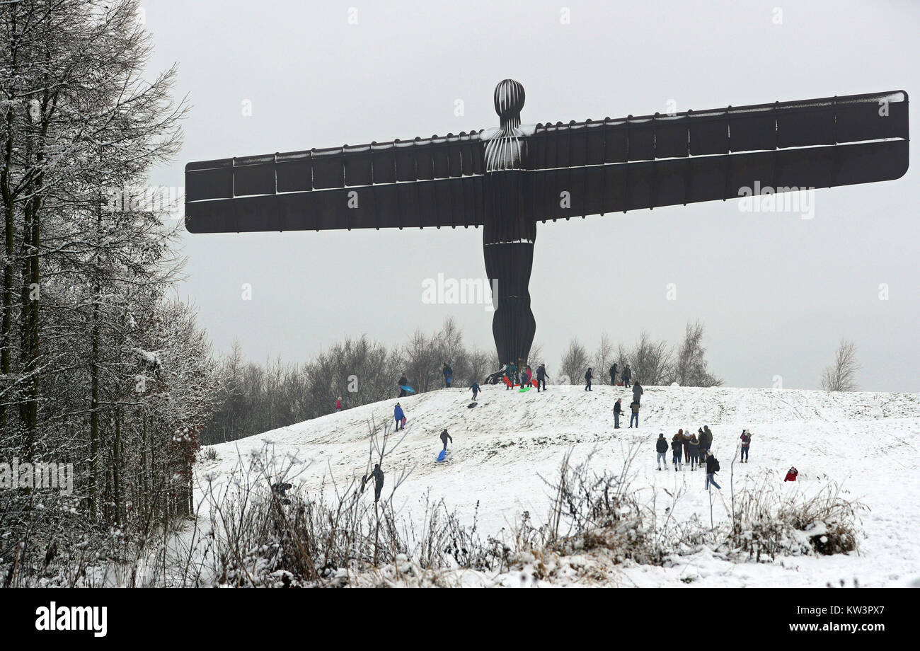 People sledging under the Angel of the North in Gateshead, after heavy ...