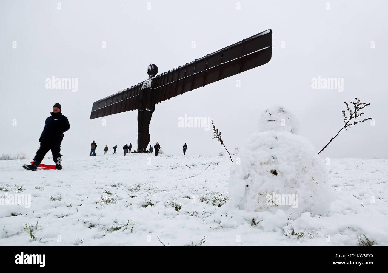 A snowman by the Angel of the North in Gateshead, after heavy snow ...