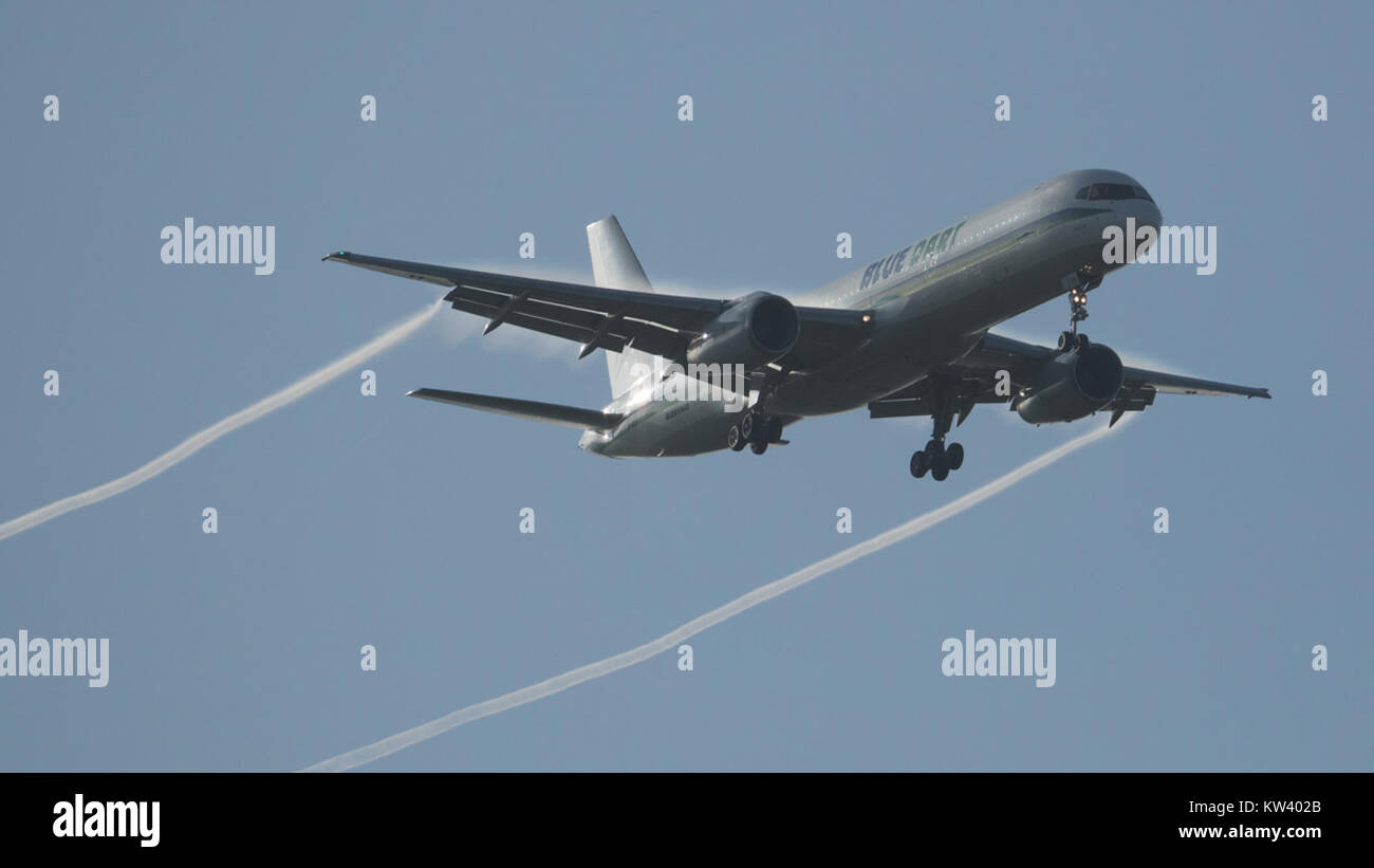 This photograph captures contrails from a BlueDart aircraft, with dew ...