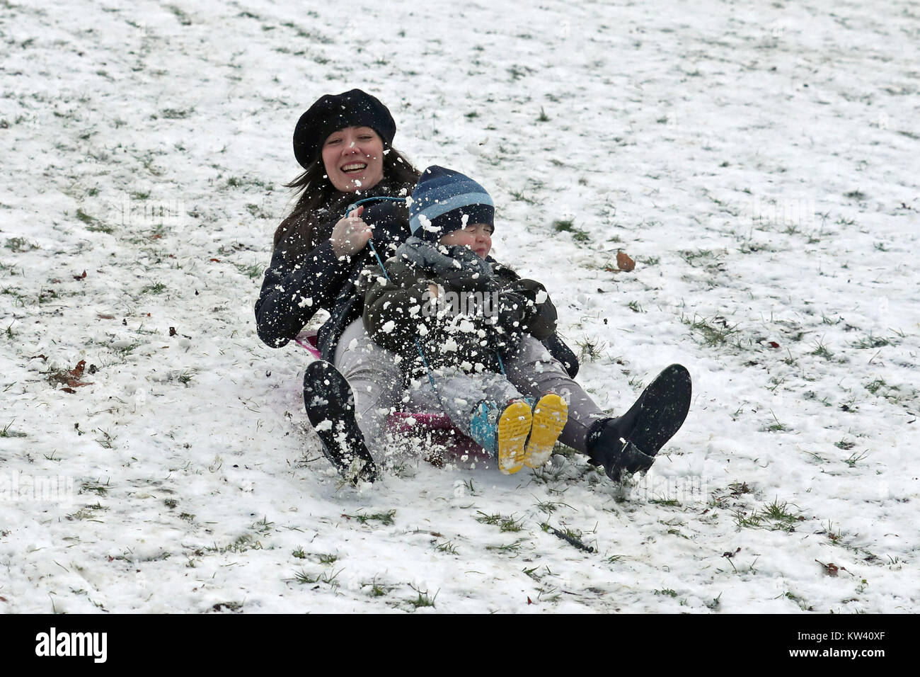 Zoe Foley with her three-year-old son Cooper sledging at Kelvingrove ...
