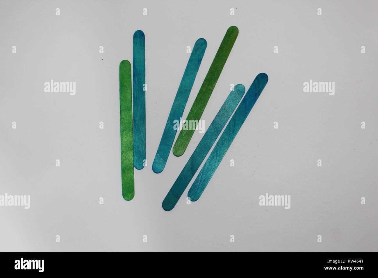 This image shows blue and green craft sticks, commonly used in arts and ...
