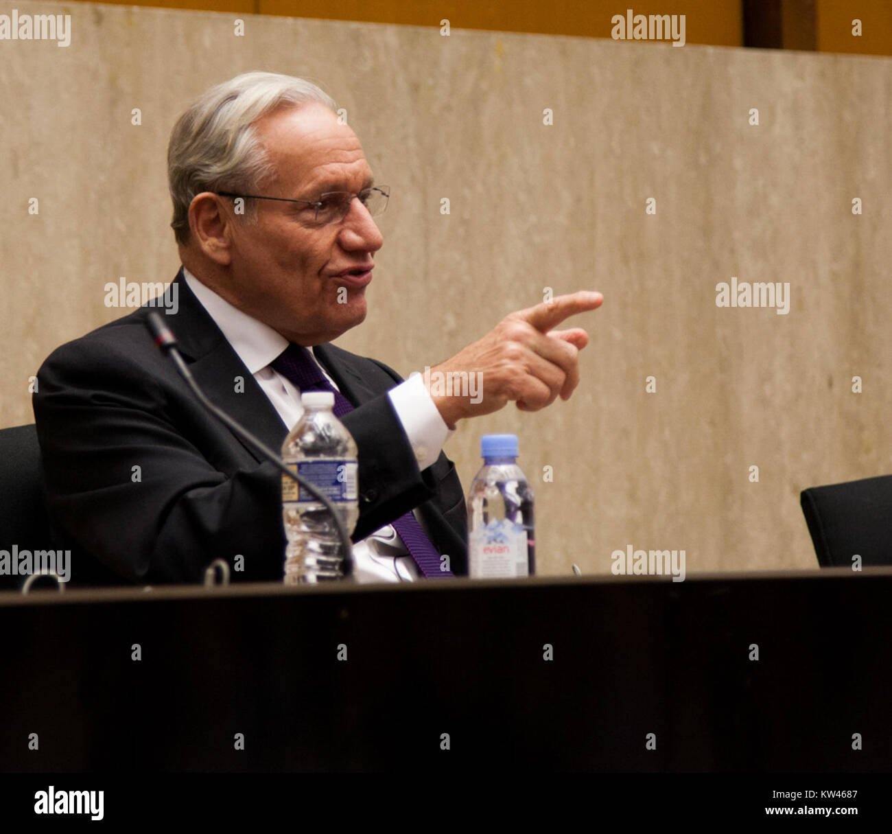 A photograph capturing journalist Bob Woodward engaging with ...