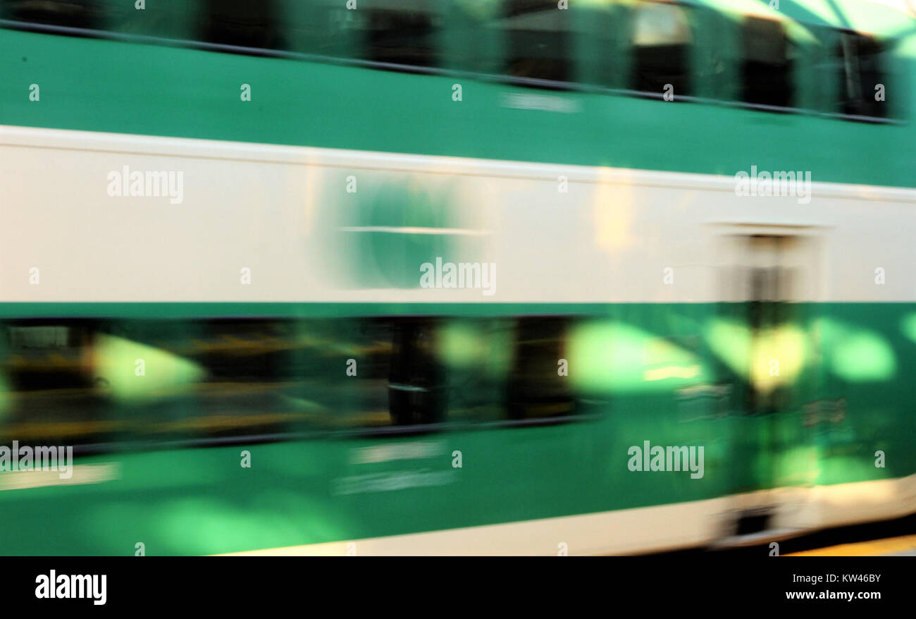 A blurred image of a GO Train, a regional transit train operating in ...