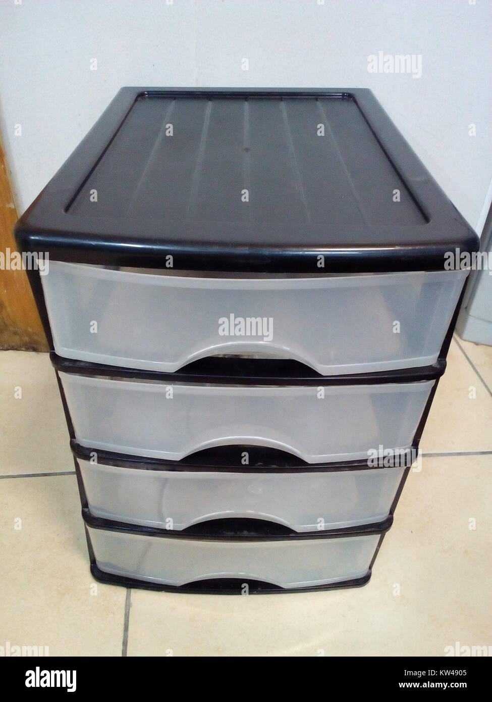 This black plastic chest of drawers is designed for desktop use ...