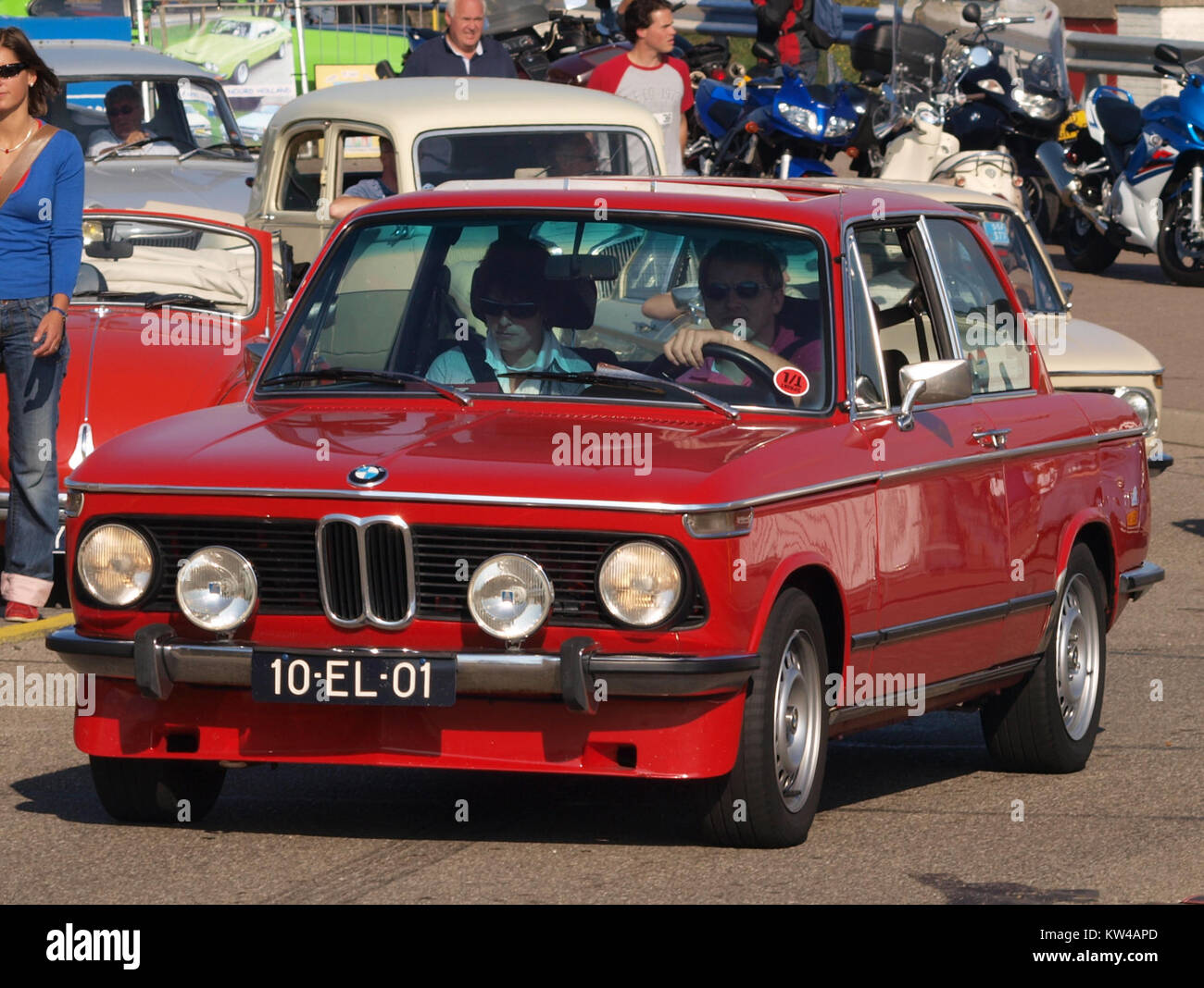 This image shows a BMW 2002 TII, a classic sports car, with Dutch ...