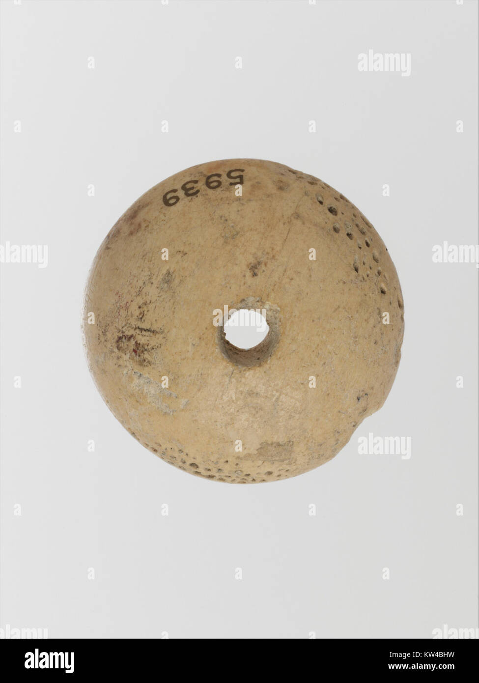 This bone disk or button, housed in the Metropolitan Museum of Art's ...