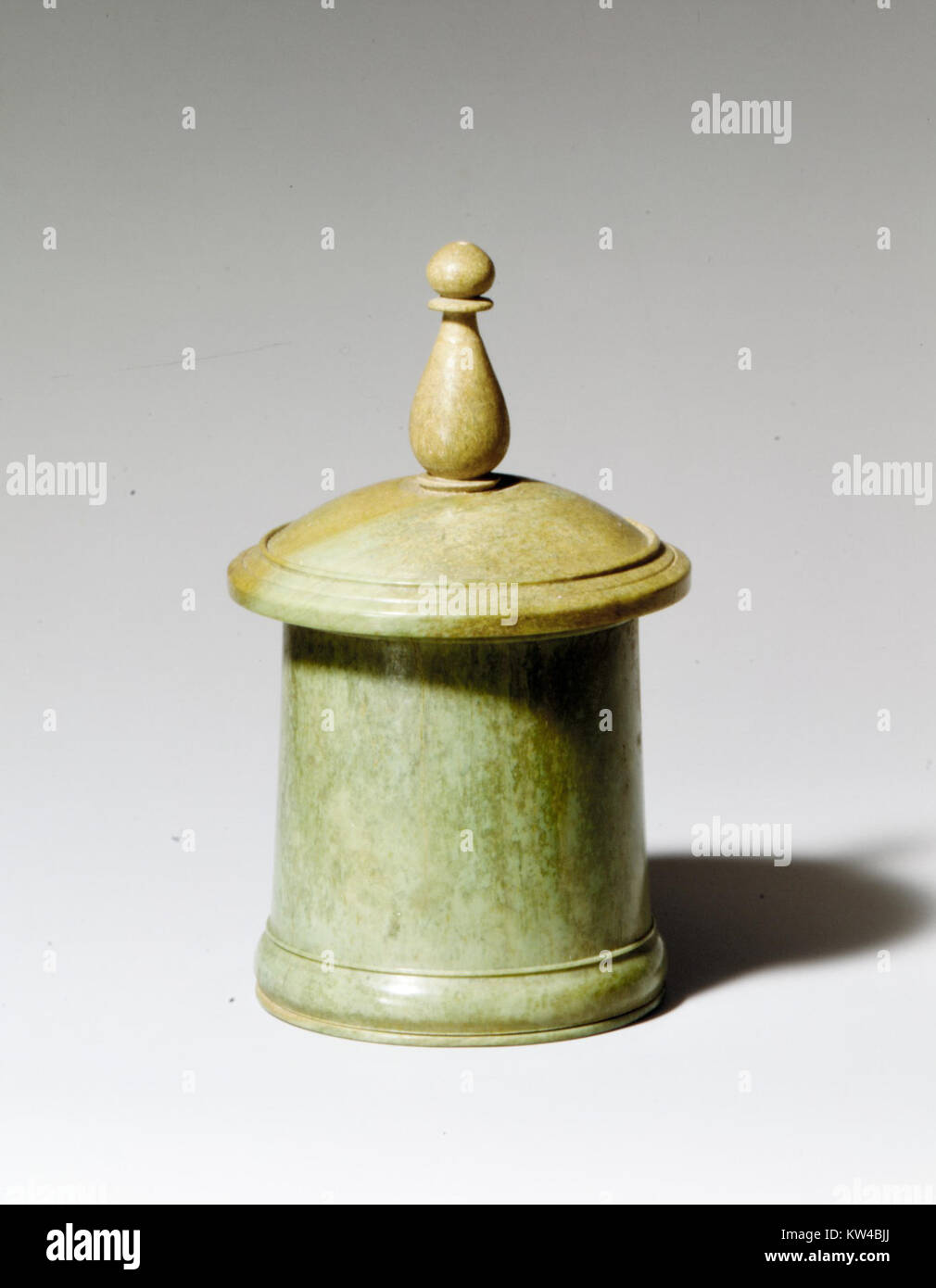 This bone pyxis, with its intricate lid, is an artifact from ancient ...