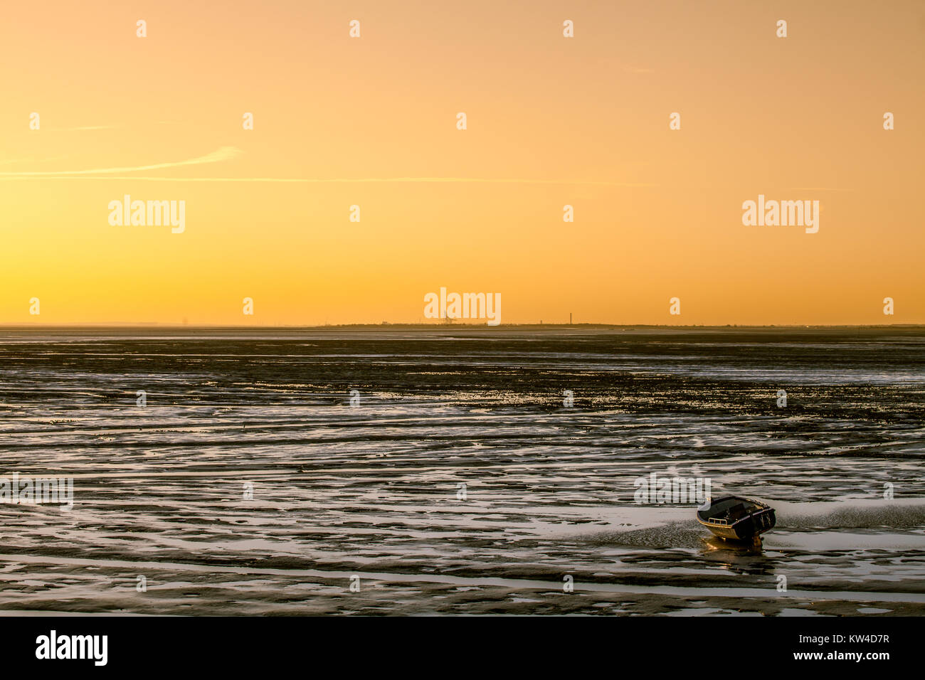 Single boat on beach when the tide is out Stock Photo - Alamy