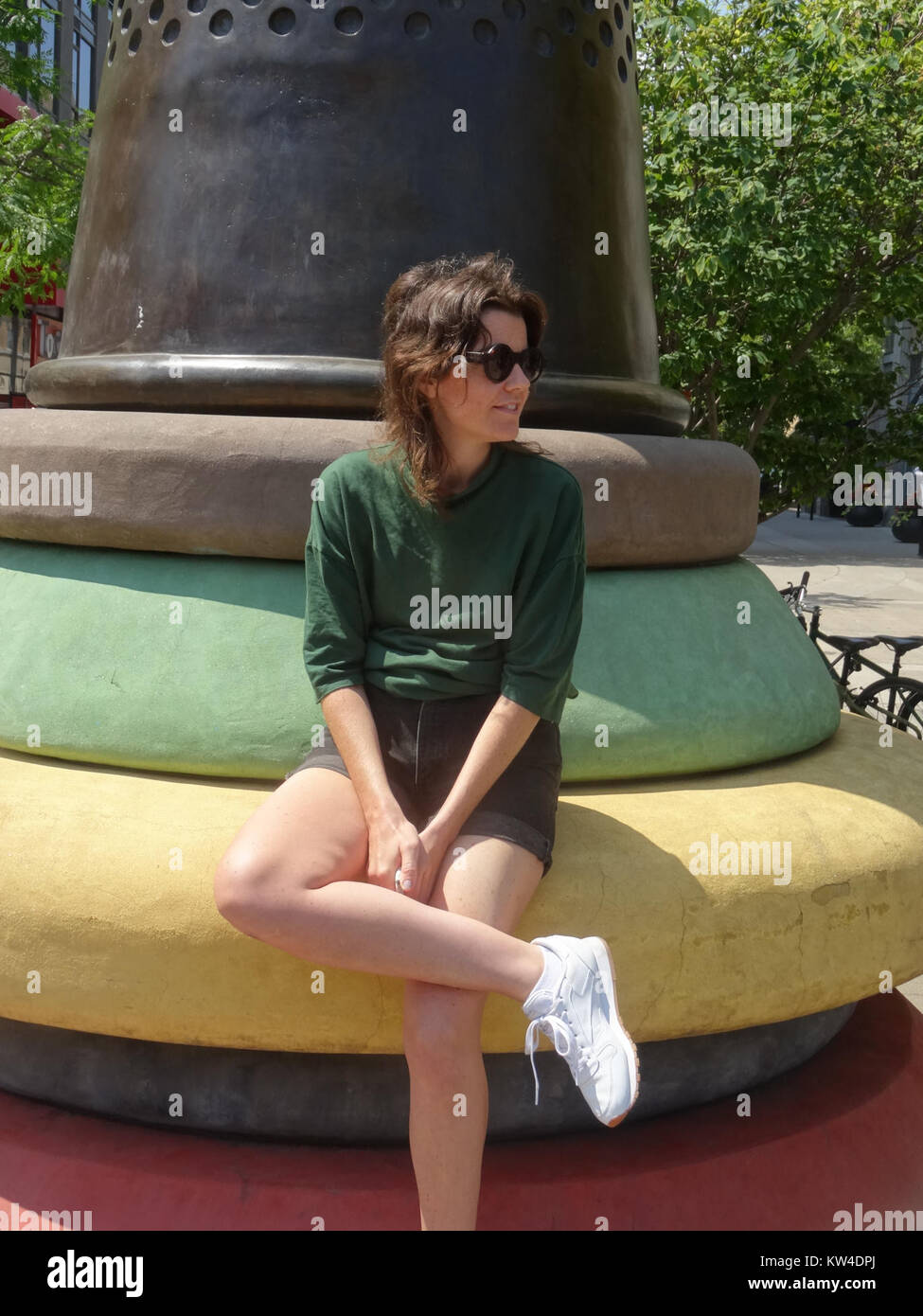 A large thimble sculpture stands in front of an architecturally ...