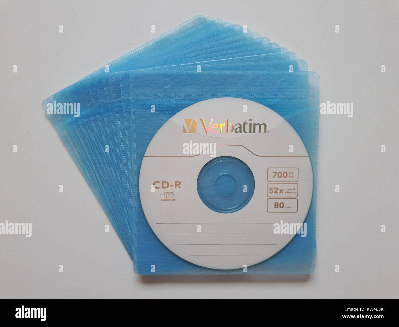 Blue plastic CD sleeves are used to protect and store CDs, providing a ...