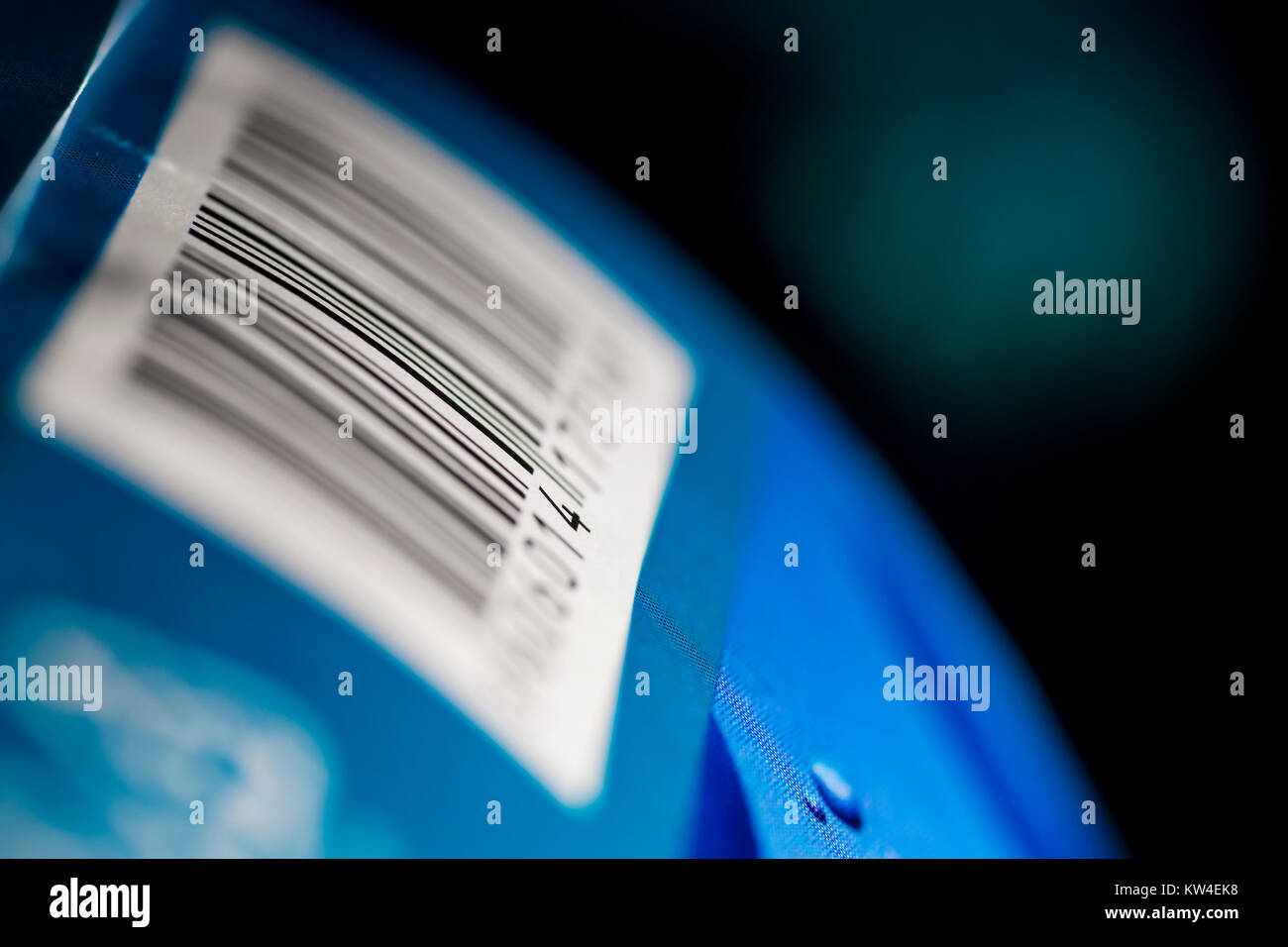 Barcode numbers on a blue product Stock Photo - Alamy