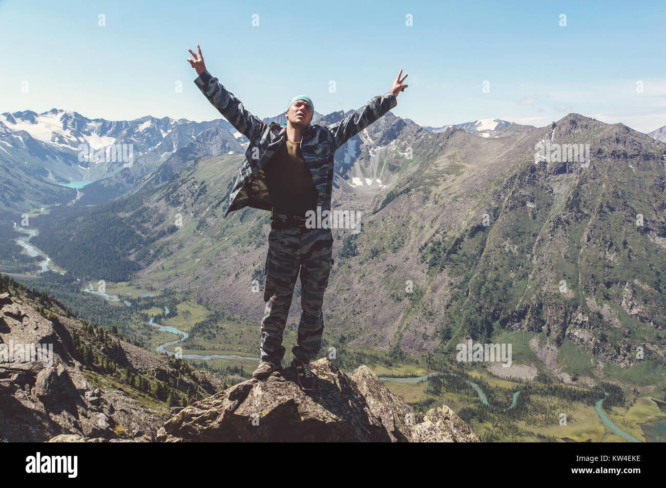 A tourist raised his hands to the sky reveal the joy of conquering the ...