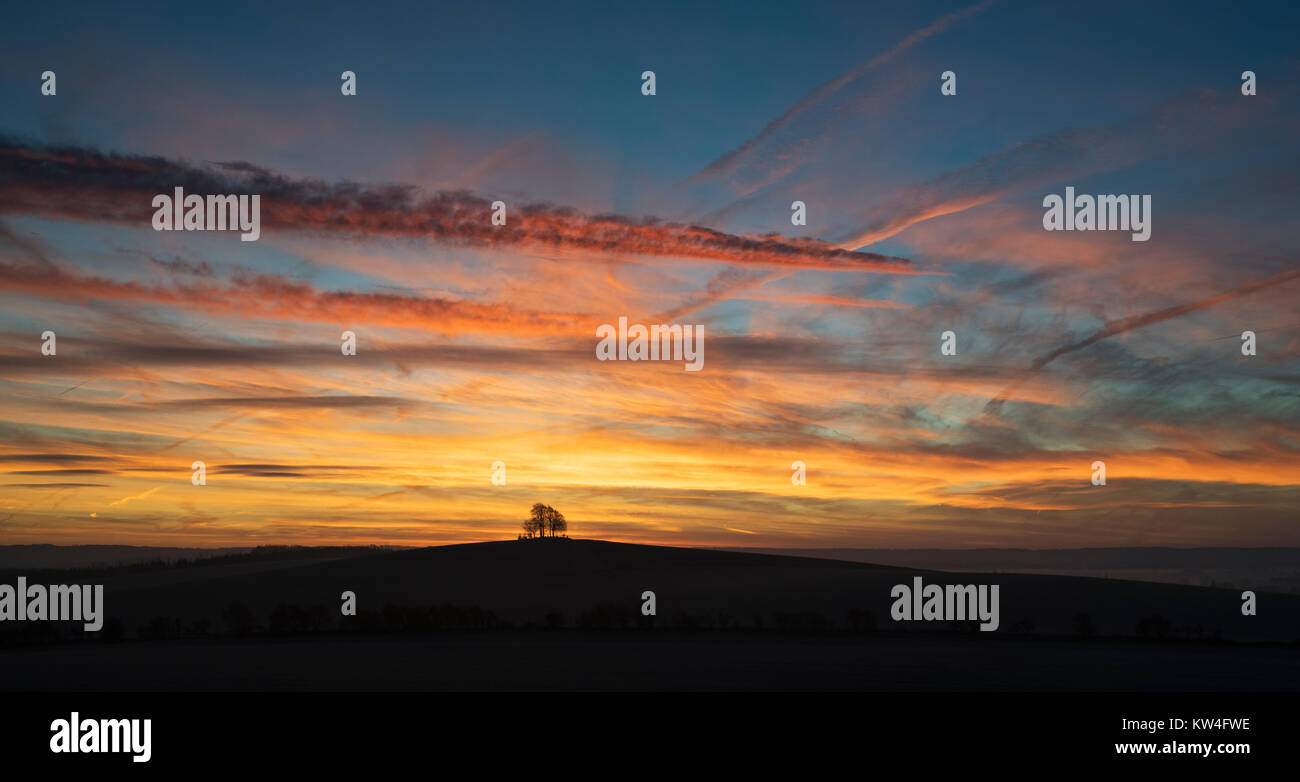 Brightwell Barrow at dawn just before sunrise with a red cloudy winter ...