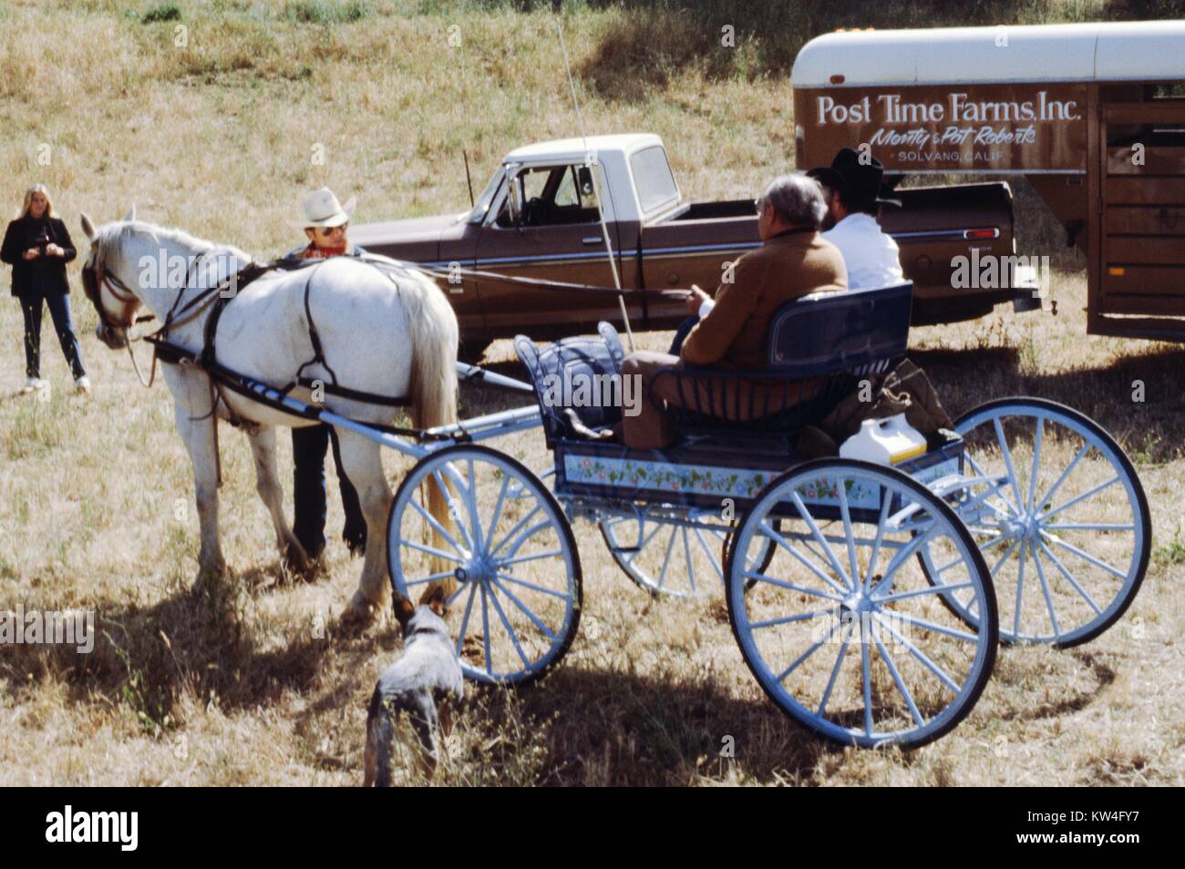 Two people ride in a horse drawn carriage at Post Time Farms in Solvang ...