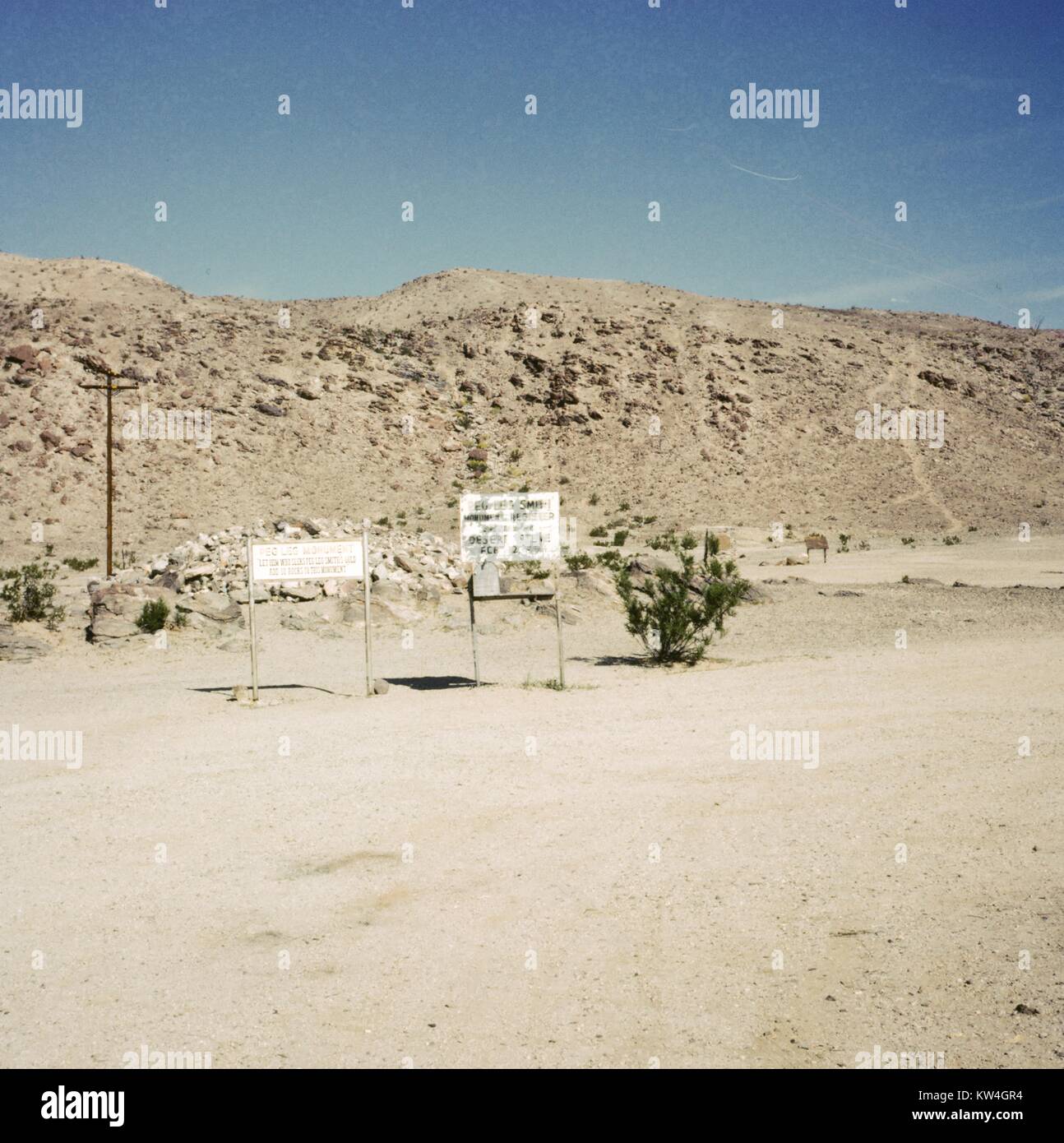 Monument to pioneer Peg Leg Smith, with sign reading 'let those who ...