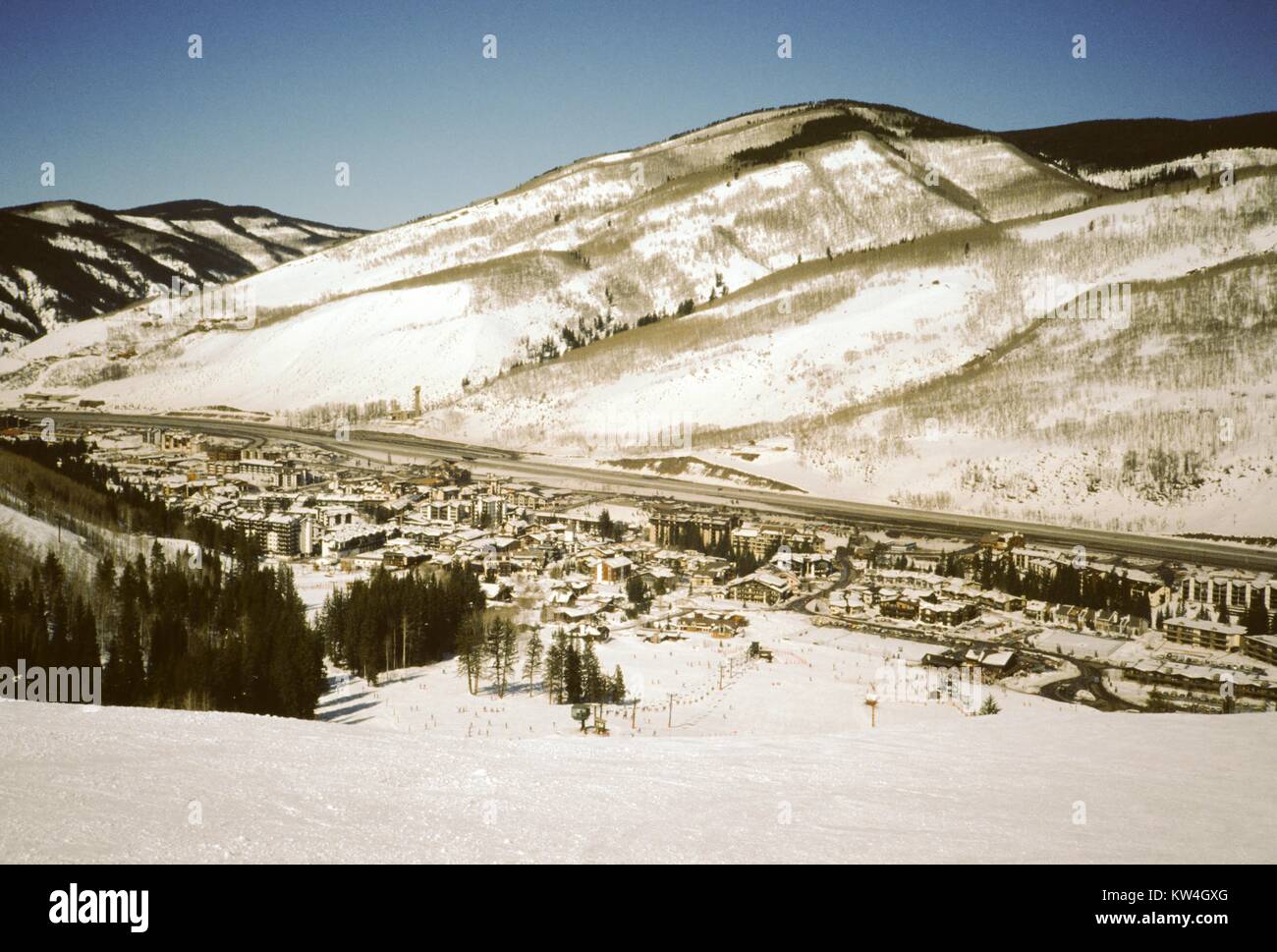 Aerial view from a mountain top of ski resorts and other buildings in ...