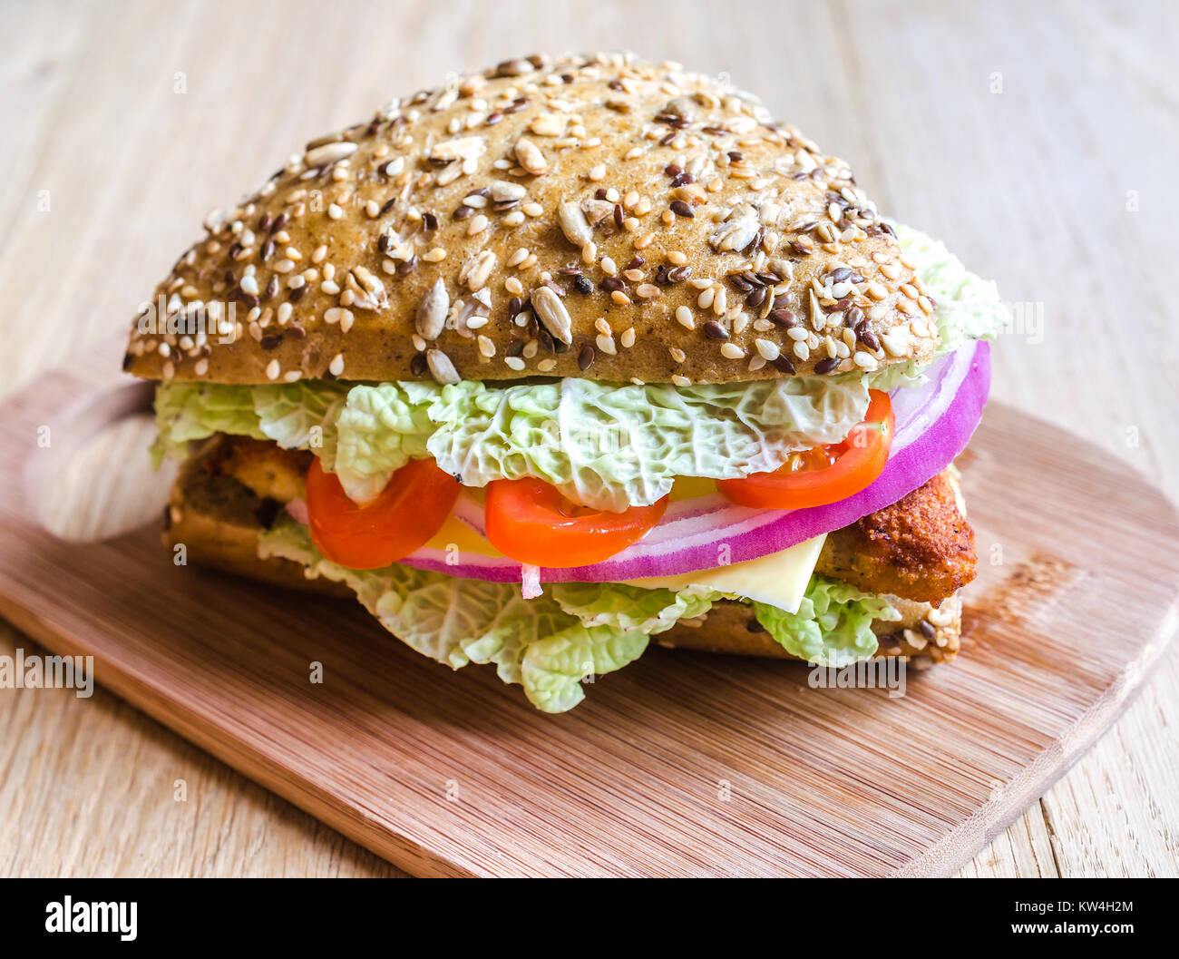 Triangle wholewheat-bun hamburger Stock Photo - Alamy