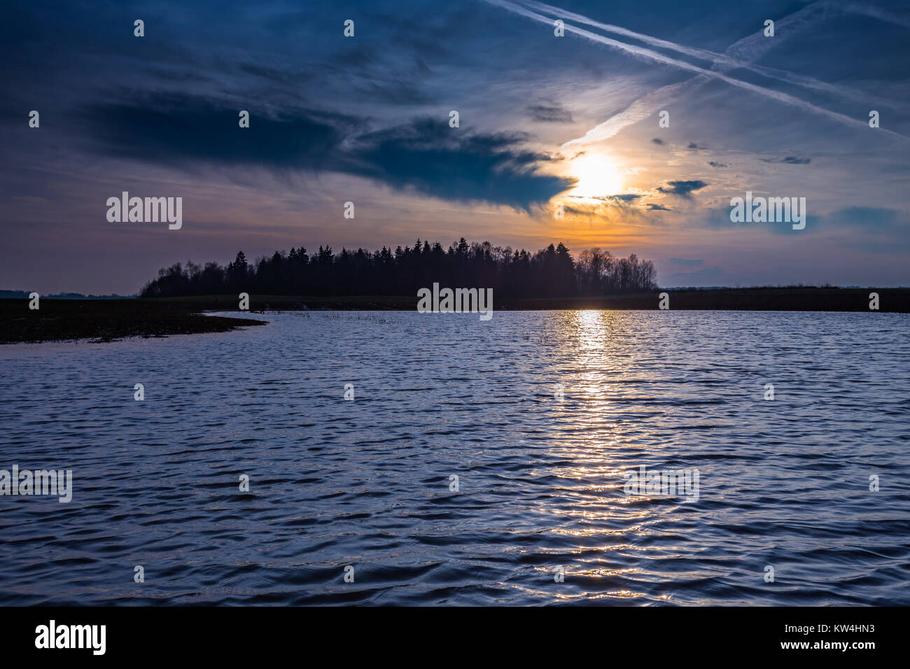 Cold blue evening sunset over the surface of water Stock Photo - Alamy