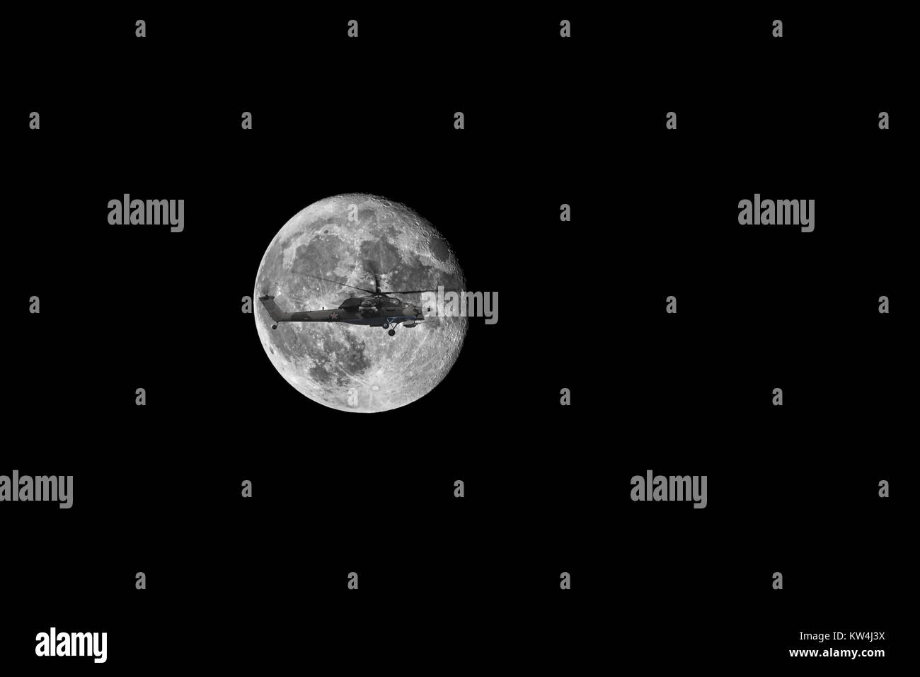Combat helicopter on the background the moon Stock Photo - Alamy