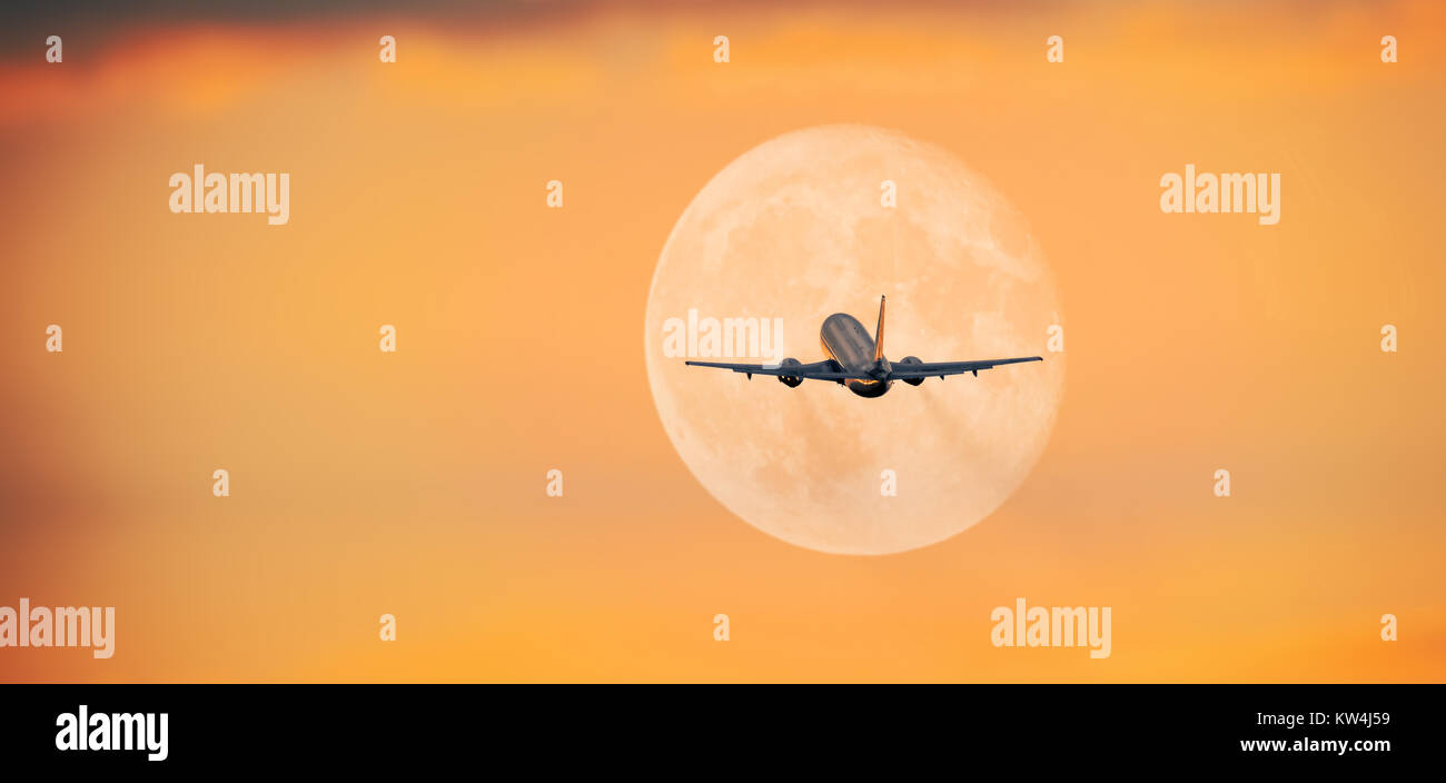 Airplane in the air and sunset in background Stock Photo - Alamy
