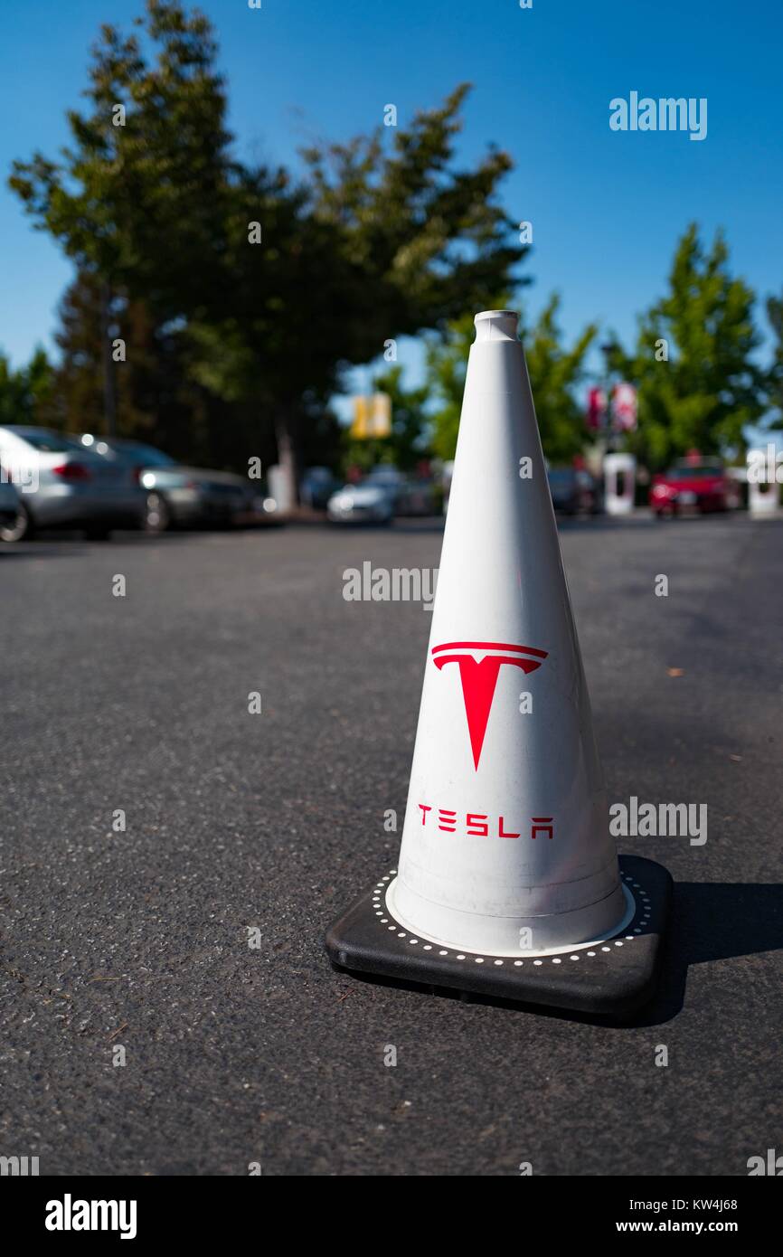 Traffic cone with logo for the electric vehicle company Tesla Motors in ...