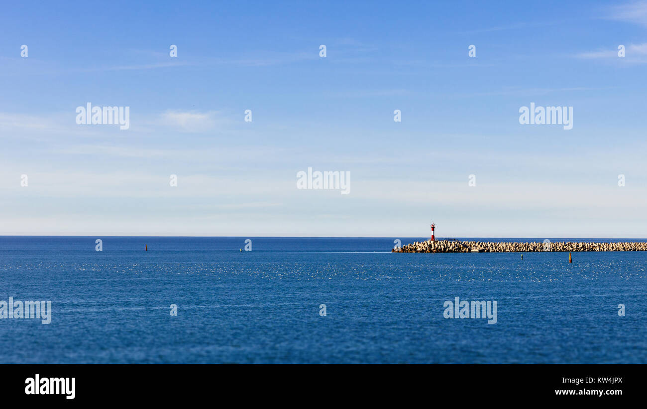 Lighthouse at the port Stock Photo - Alamy