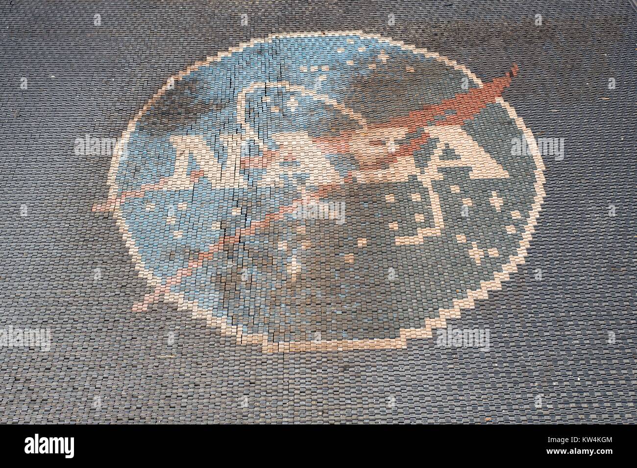 Faded, worn and dirty NASA logo on a high-traction surface outside NASA ...