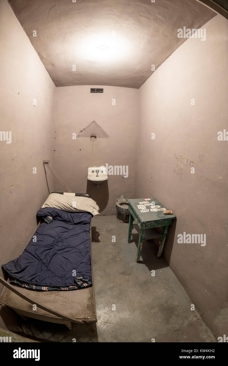 Close up of a single jail cell with sleeping quarters Stock Photo - Alamy
