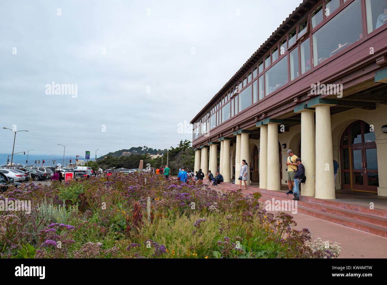 Tourists sit outside the Beach Chalet restaurant in Golden Gate Park ...