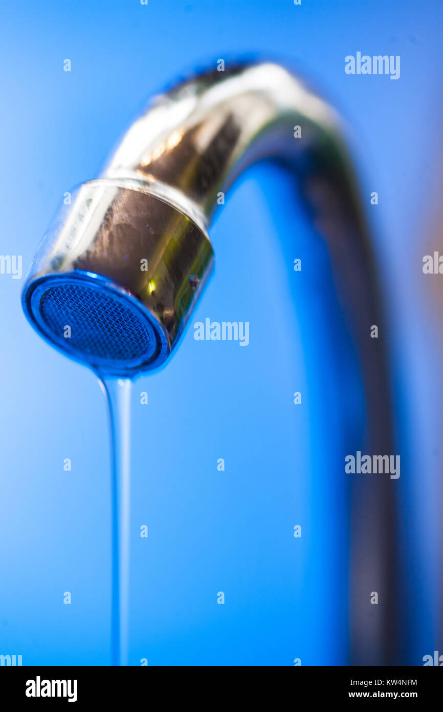 Tap with dripping waterdrop. Water leaking, saving Stock Photo - Alamy