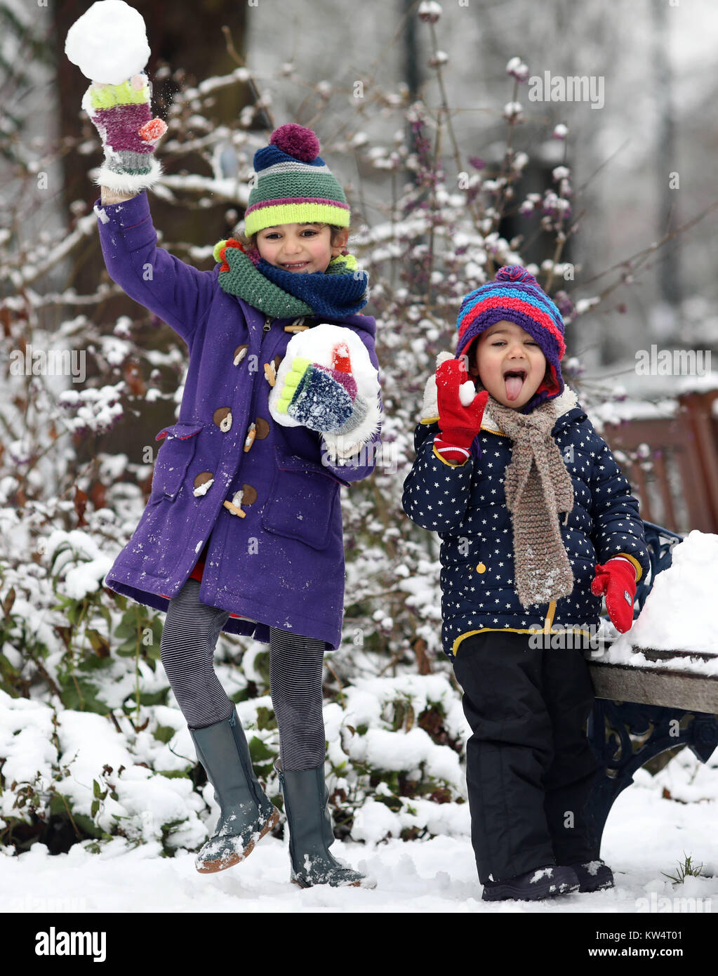 Children throwing snowballs hi-res stock photography and images - Alamy