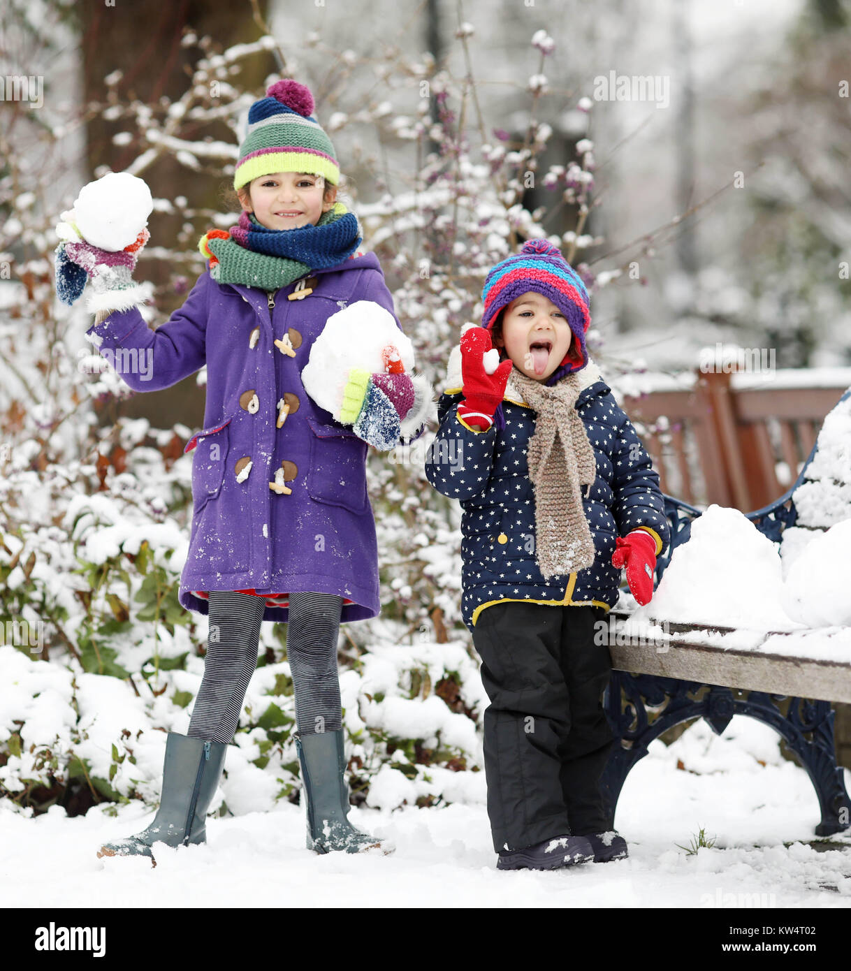 Children throwing snowballs hi-res stock photography and images - Alamy