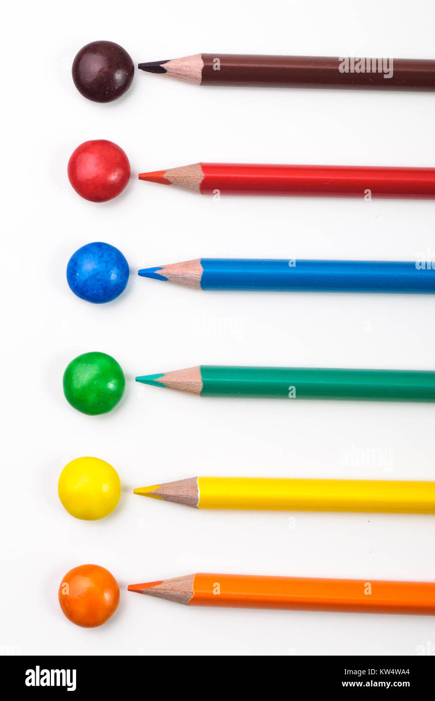 Colorful candys and penciles Stock Photo - Alamy