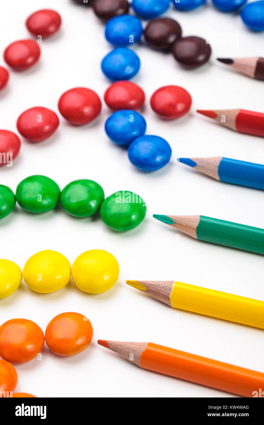 Colorful candys and penciles Stock Photo - Alamy
