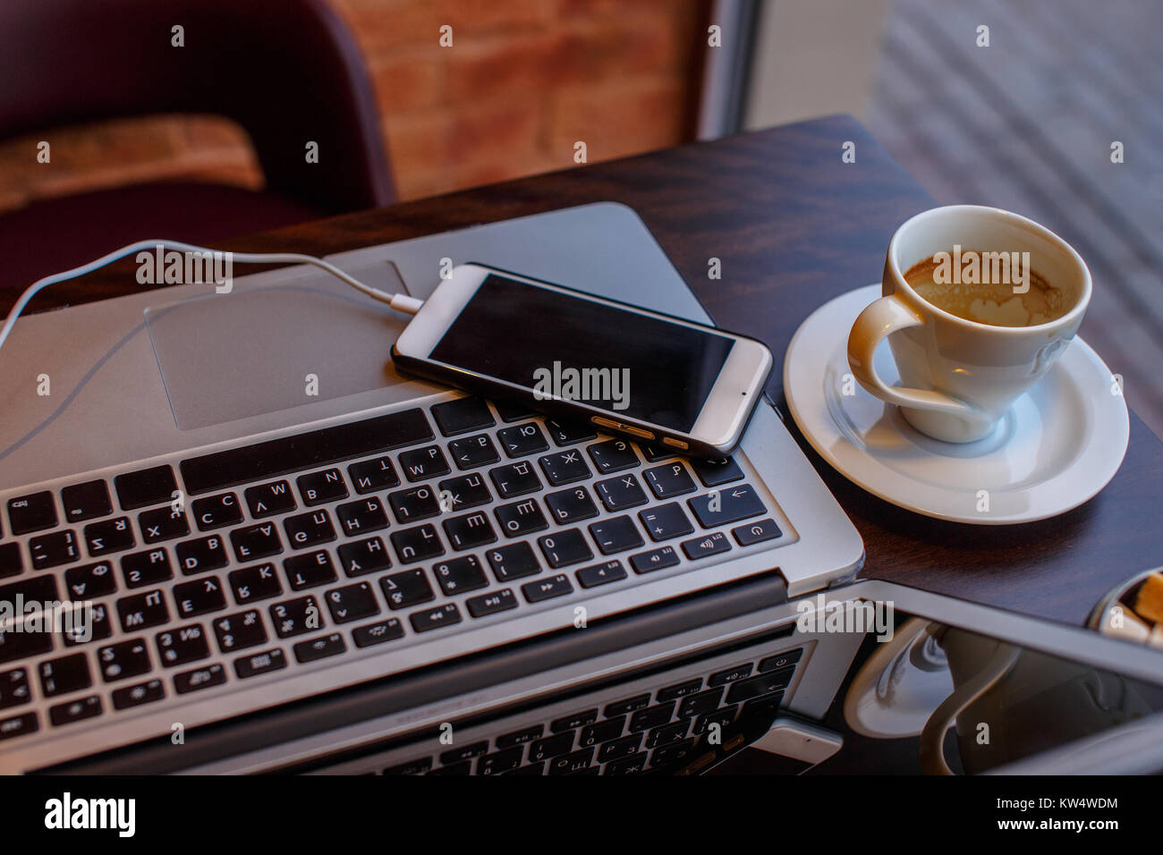 A laptop's keyboard and a cup of coffee Stock Photo - Alamy