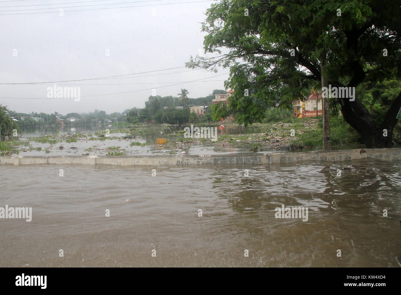 Floooding on the street and rain in Mandalay, Myanmar Stock Photo - Alamy