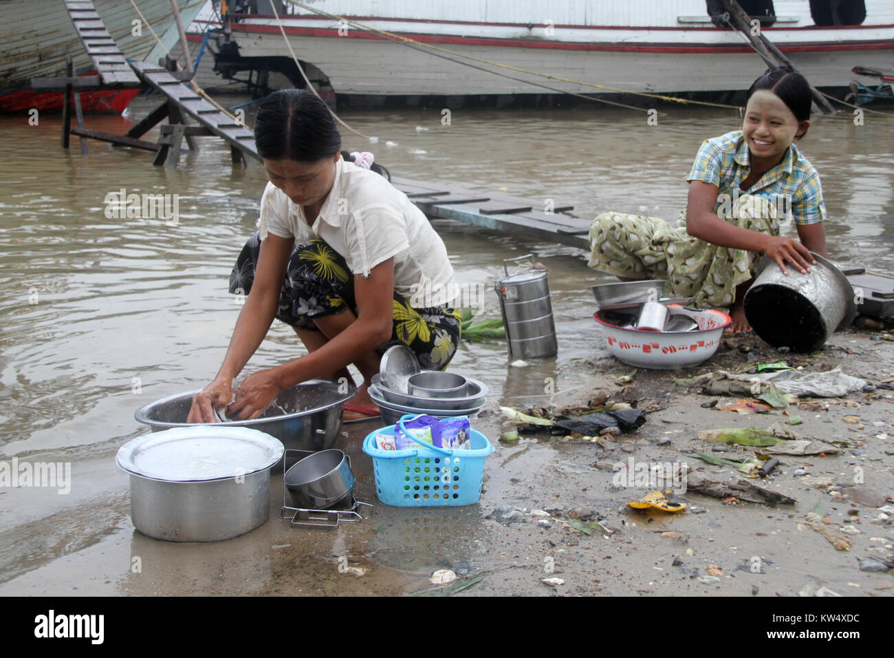 Washing dishes in the river hi-res stock photography and images - Alamy