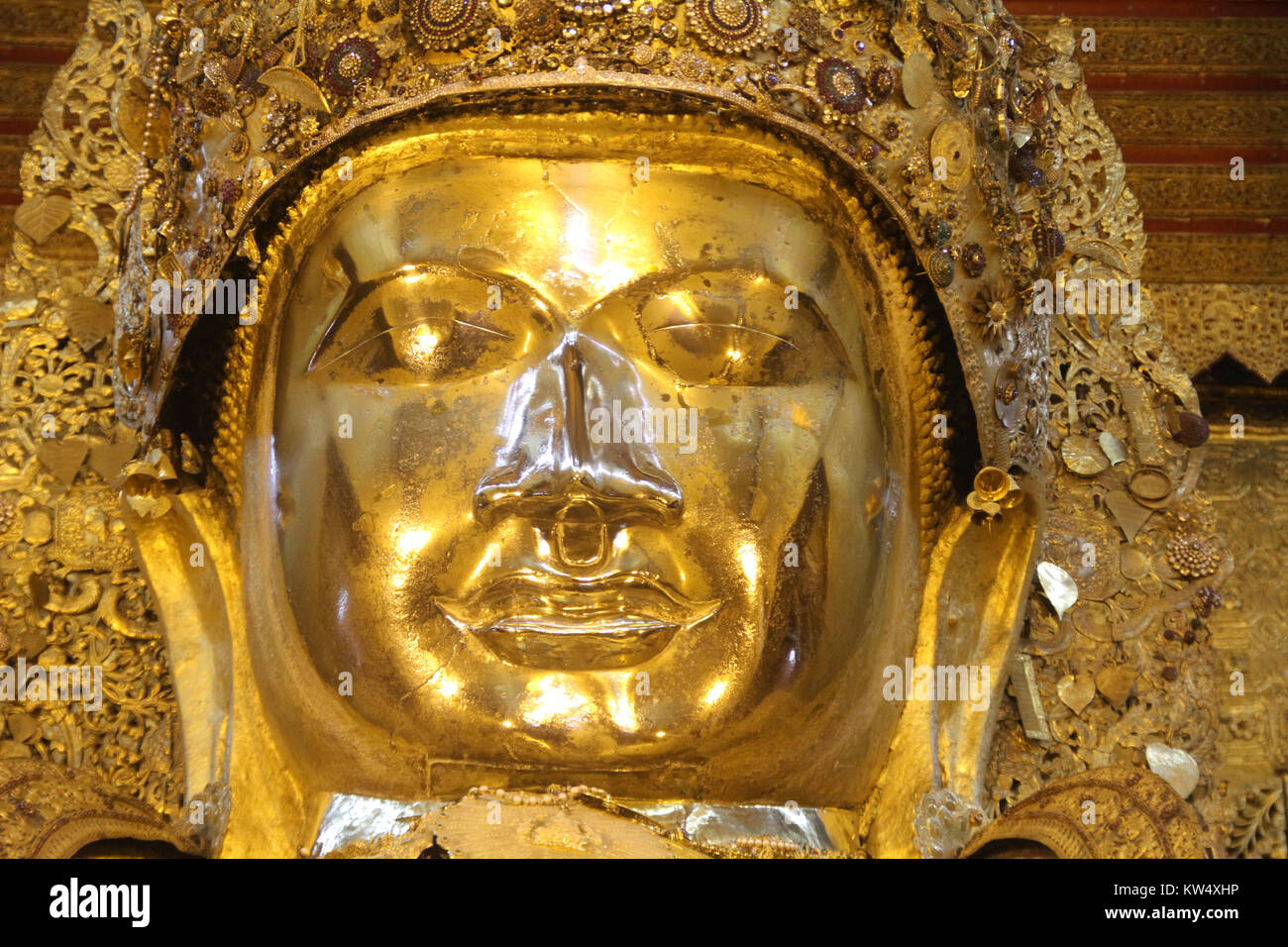 Face of golden Mahamuni Buddha statue in Mandalay, Myanmar Stock Photo ...