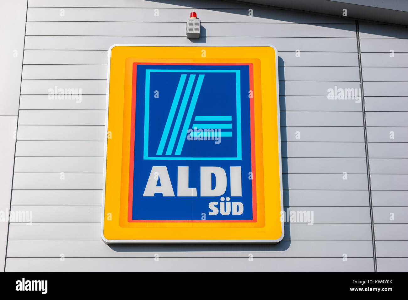 Aldi sign (south division) against blue sky. Aldi is a leading global ...