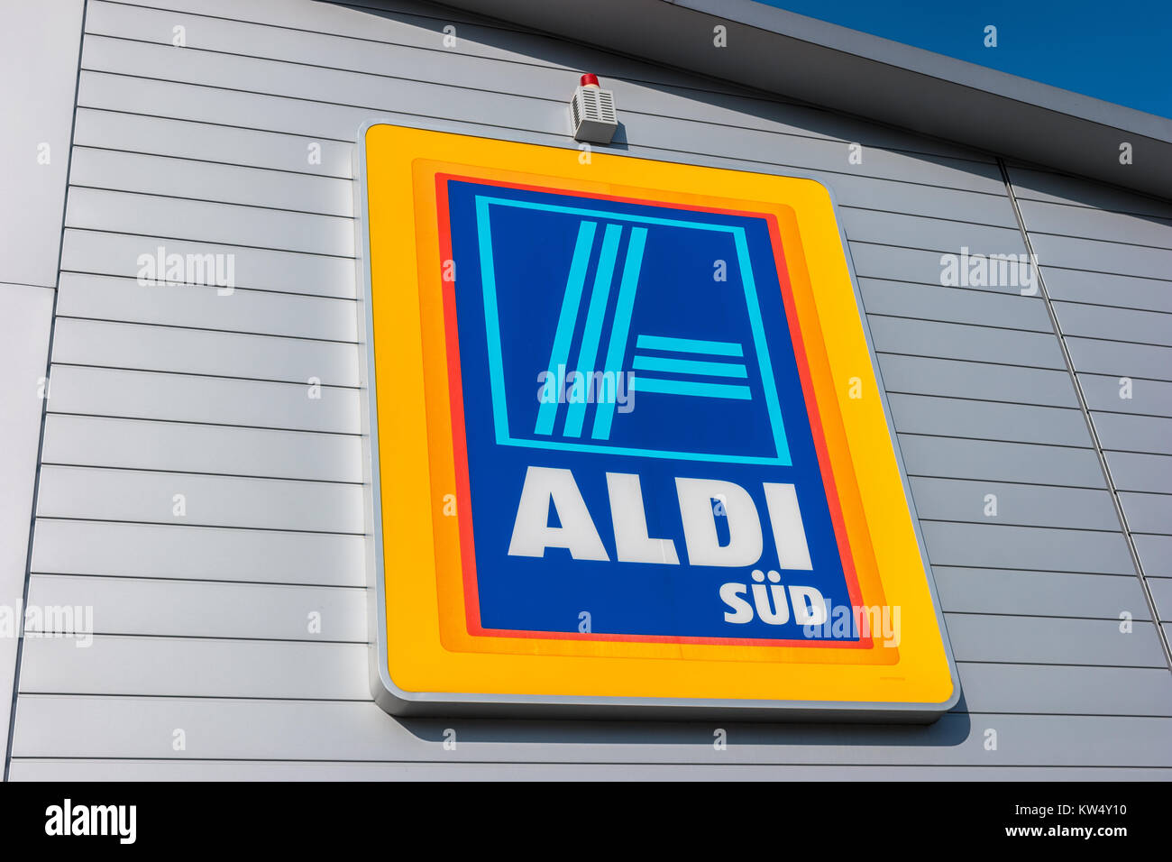 Aldi sign (south division) against blue sky. Aldi is a leading global ...