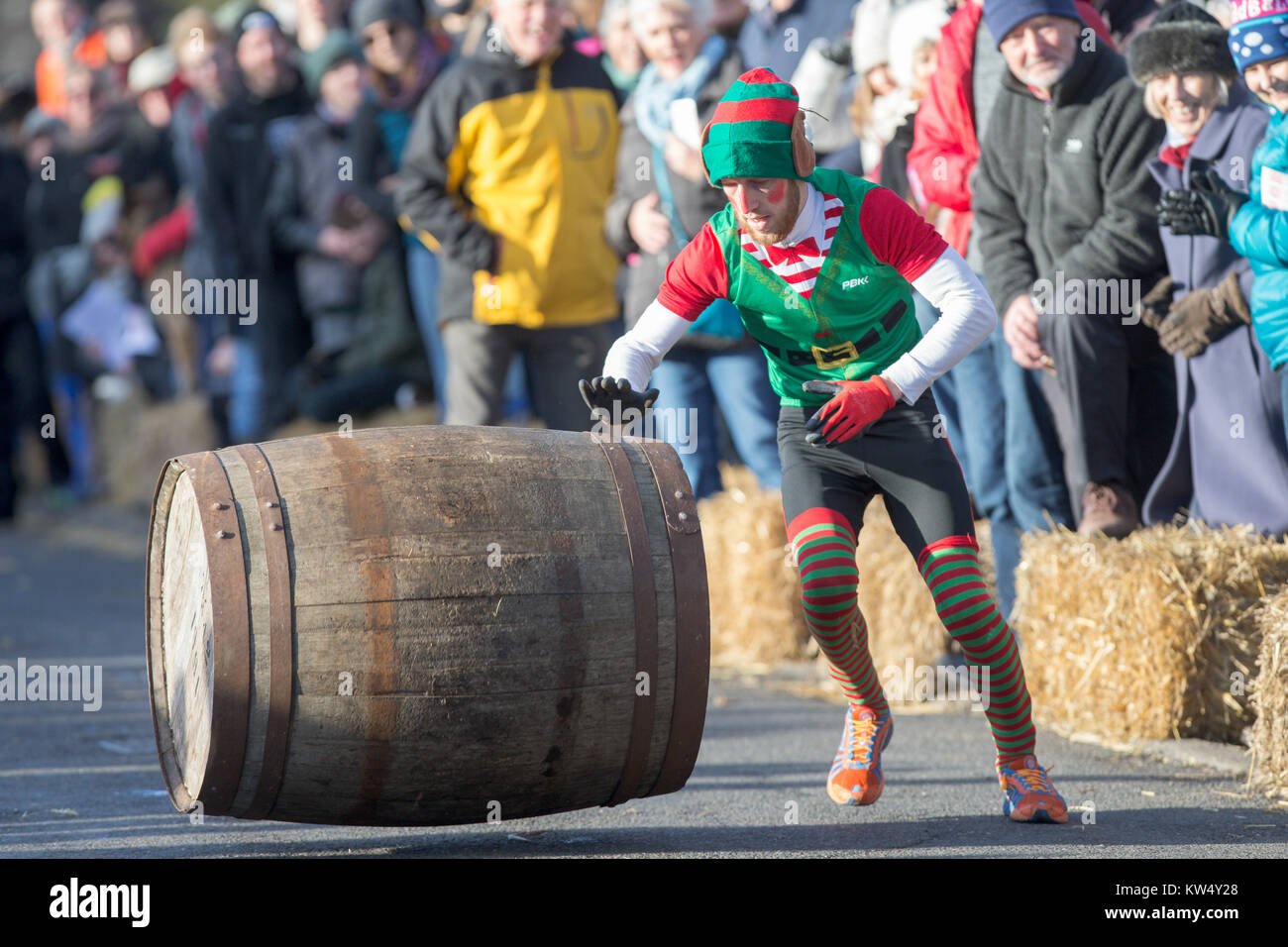 Picture shows competitors trying to control their barrel in the annual ...