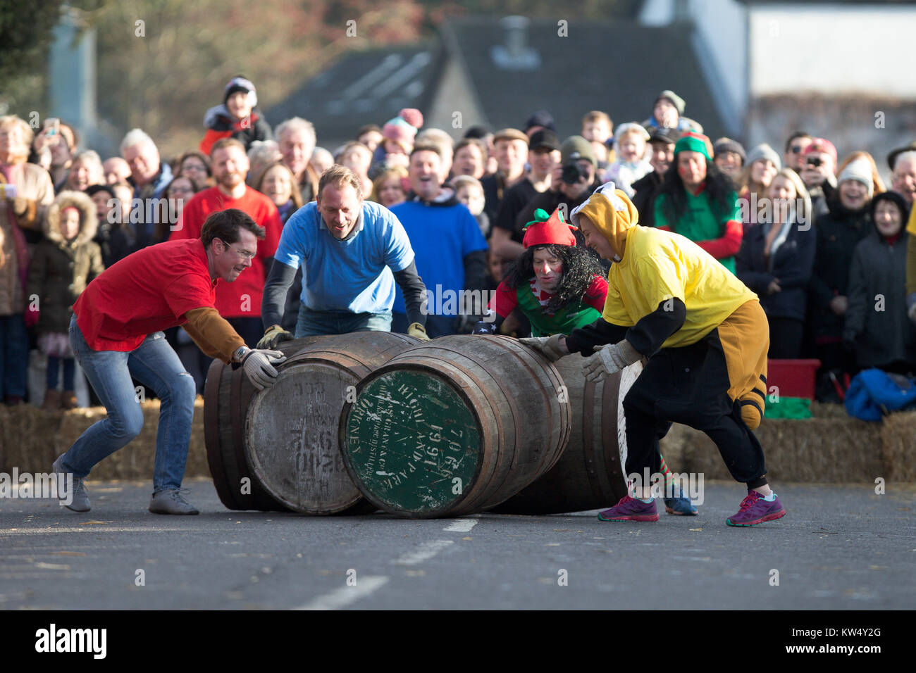 Picture shows competitors trying to control their barrel in the annual ...