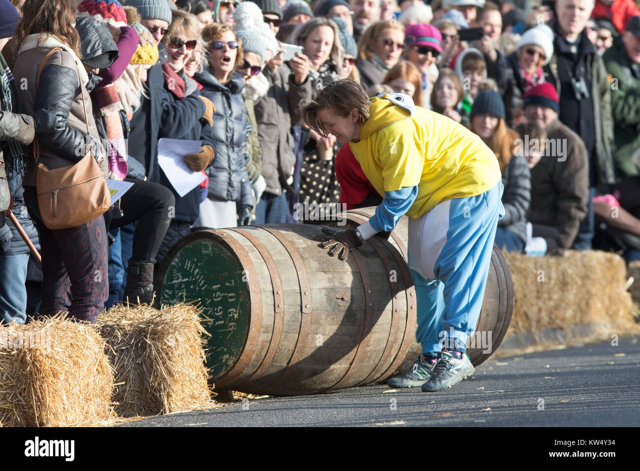 Picture shows competitors trying to control their barrel in the annual ...